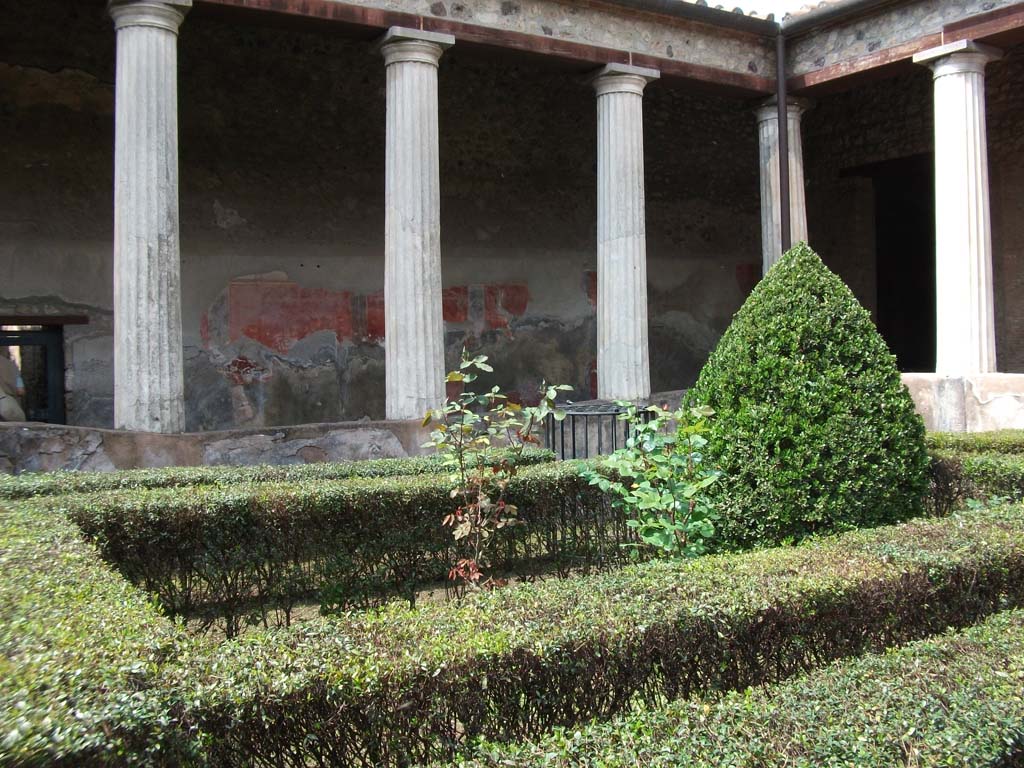 I.10.4 Pompeii. May 2010. Looking north-west across peristyle garden on the route of the Sarno ...